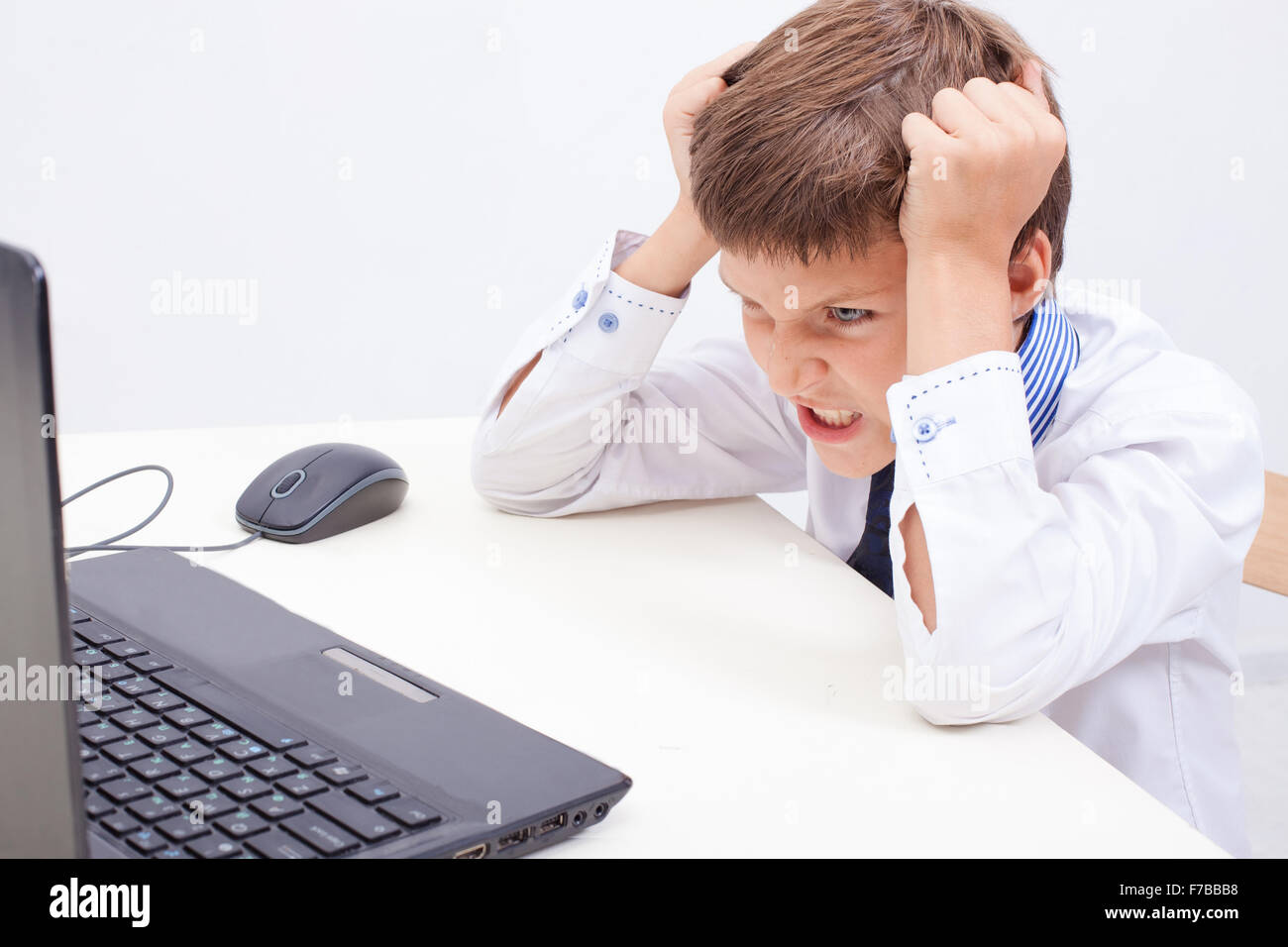 Boy using his laptop computer Stock Photo - Alamy