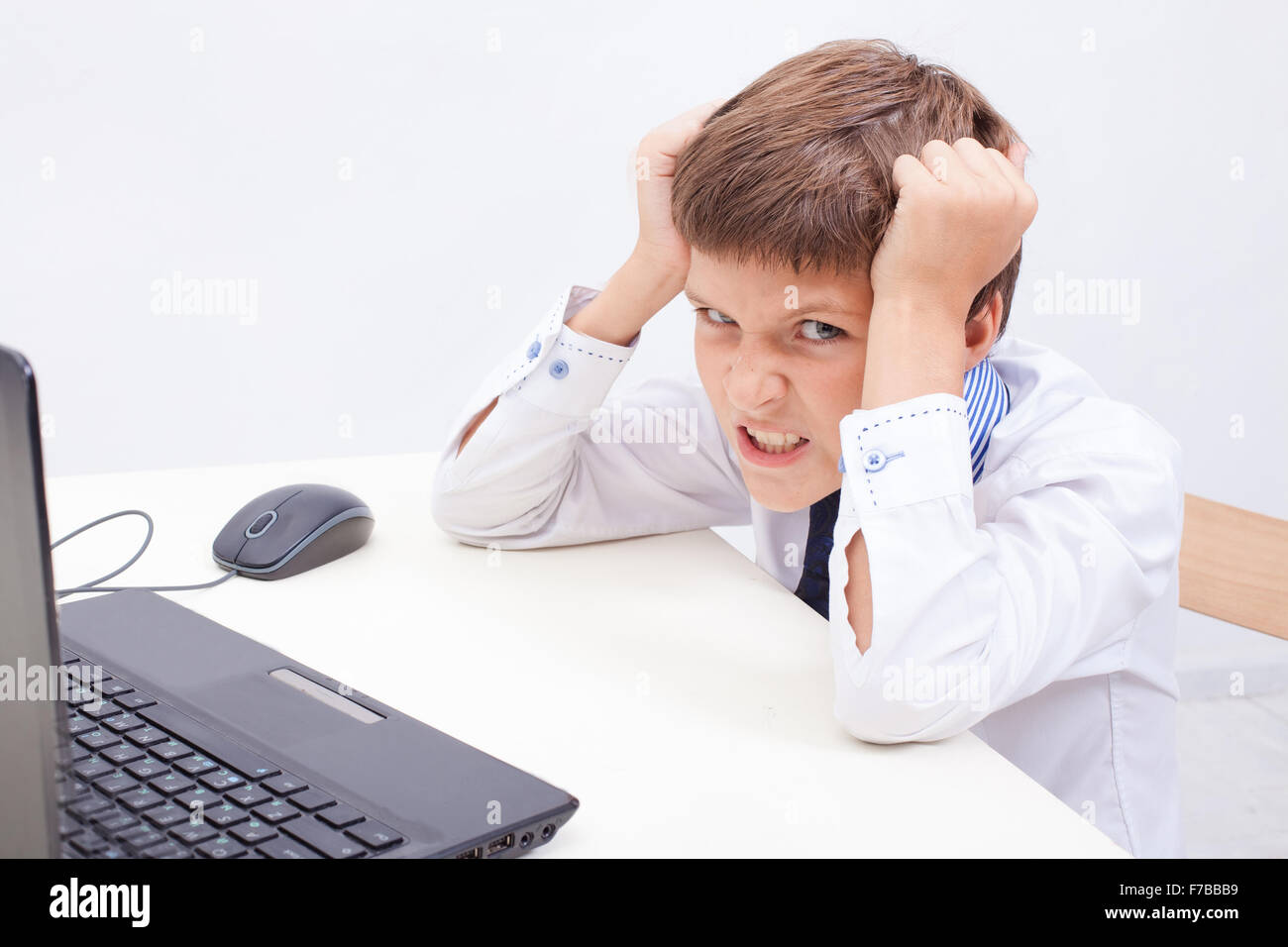 Boy using his laptop computer Stock Photo - Alamy