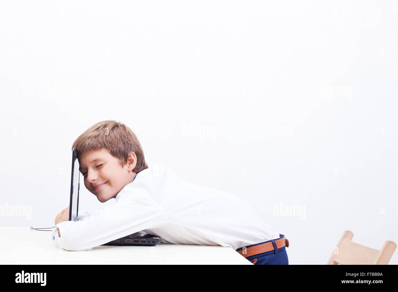 Boy using his laptop computer Stock Photo - Alamy