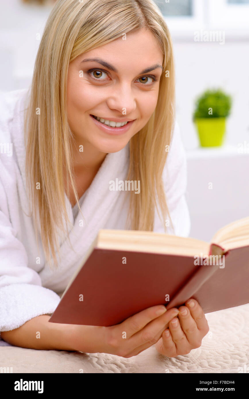 Attractive woman reading a book Stock Photo - Alamy