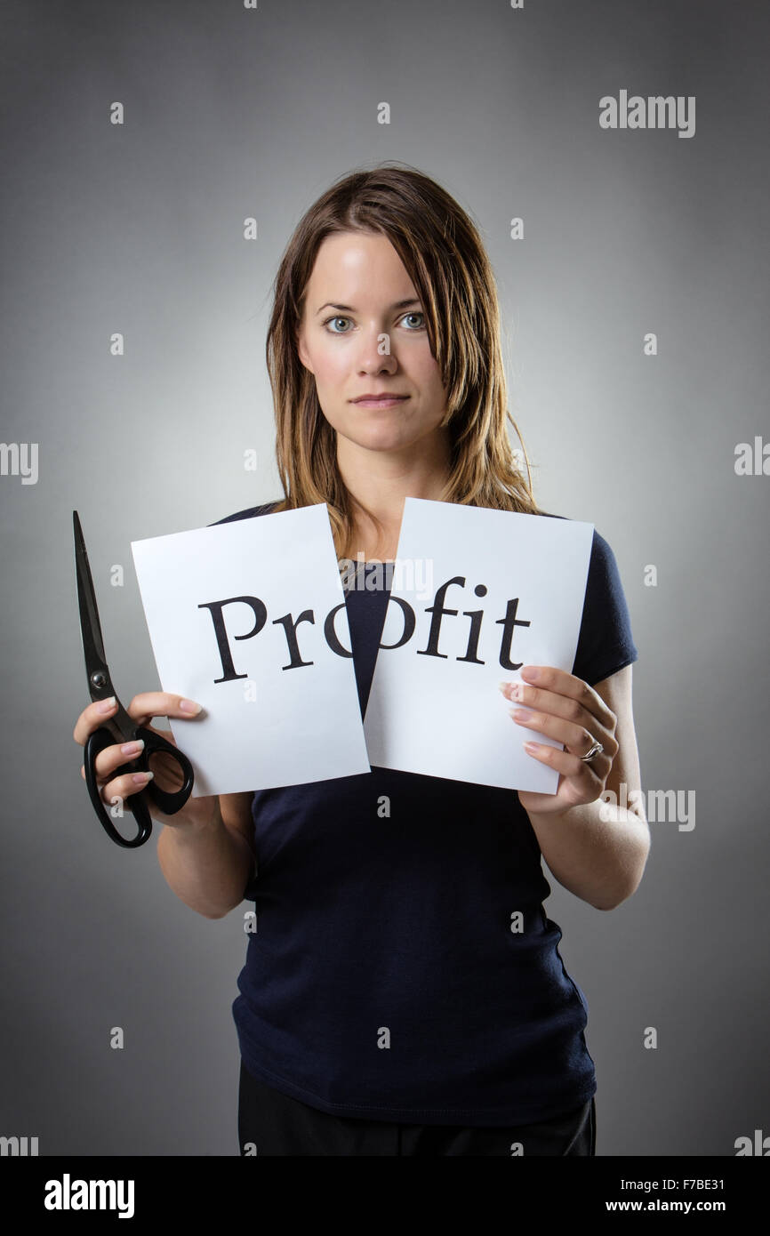stand woman cutting paper in half with the word share capital written ...