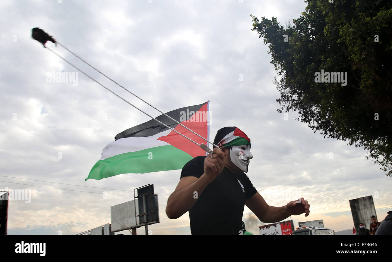 Nablus. 28th Nov, 2015. A Palestinian protester uses a sling shot to ...