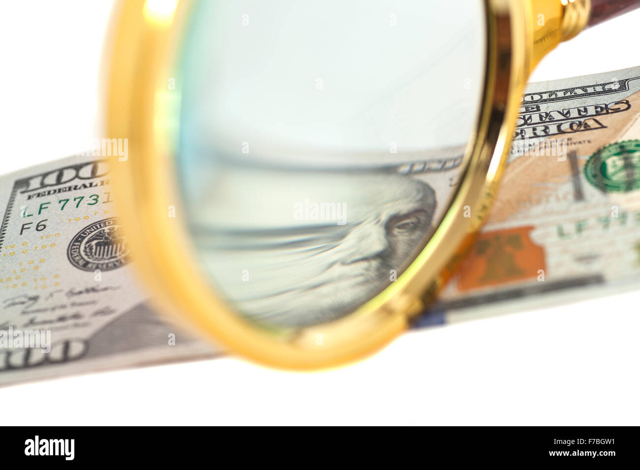 Pile dollars under magnifying glass hi-res stock photography and images ...