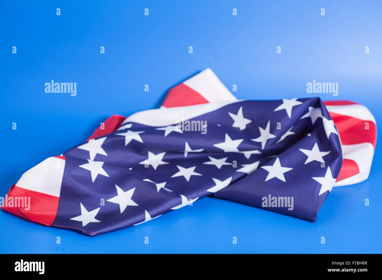 American flag on blue background Stock Photo - Alamy