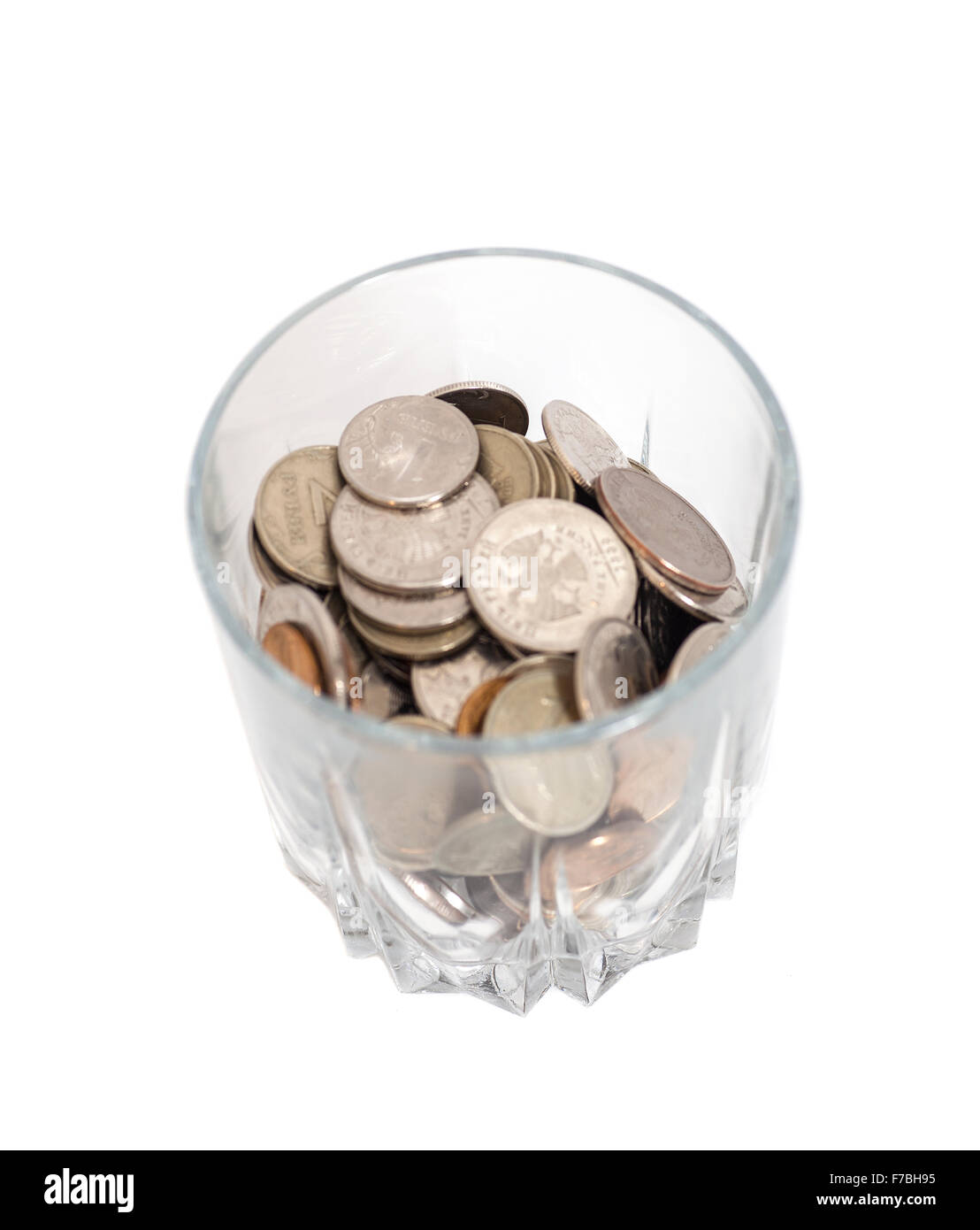 coins in glass isolated on white background Stock Photo - Alamy