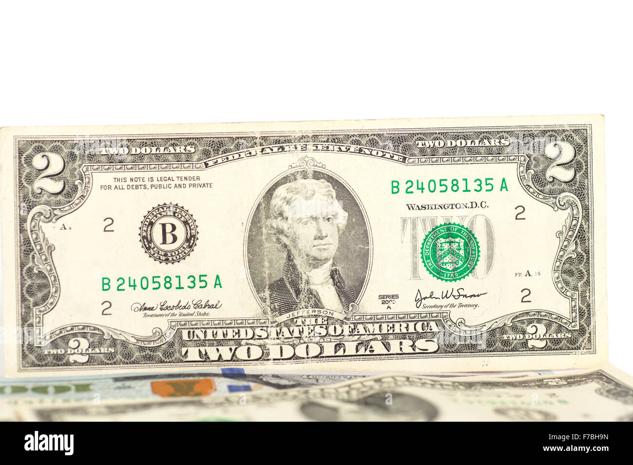 Two dollar bill isolated on white background Stock Photo - Alamy