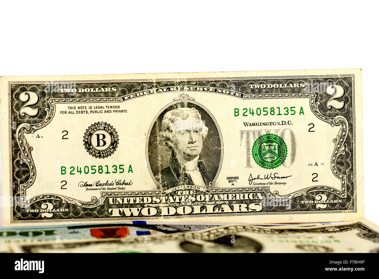 Two dollar bill isolated on white background Stock Photo - Alamy