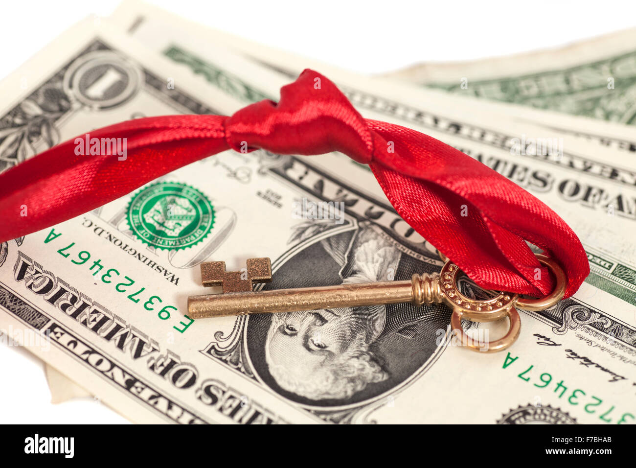Key to success on dollar banknotes isolated Stock Photo - Alamy