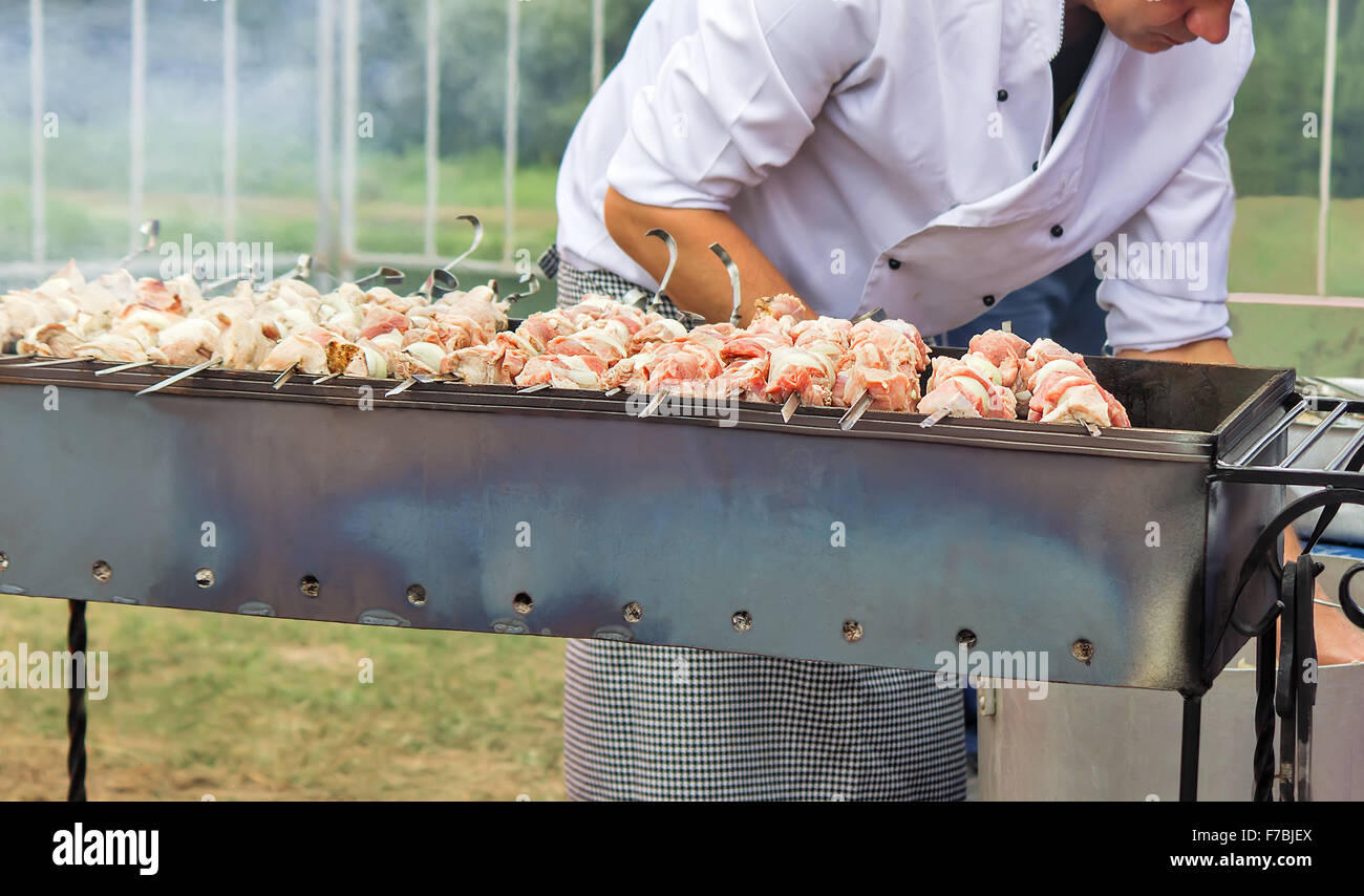 On the big man grill chef barbecue fries Stock Photo - Alamy