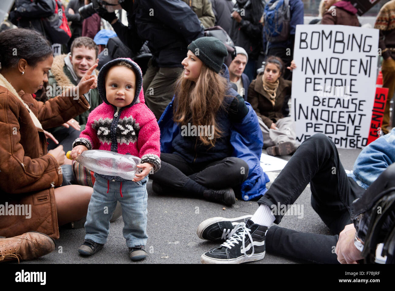London, UK. 28th November, 2015. A young child among anti-war ...
