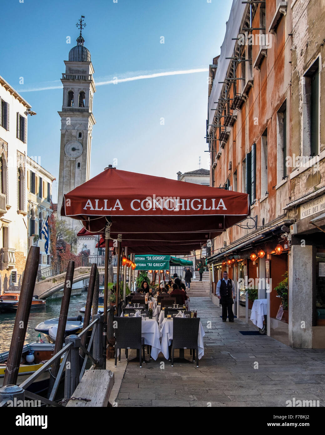 Venice, Italy. Canal side view, Restaurant with oudoor tables and ...