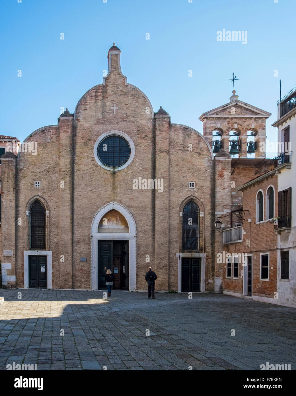 Venice, Brick gabled church with bell tower in Venetian Square Stock ...