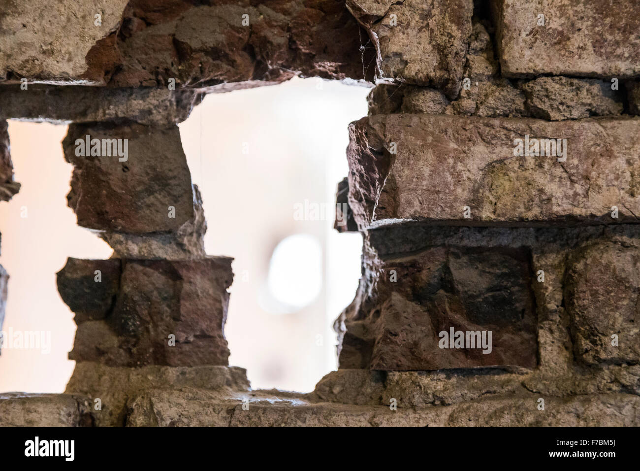 Bullet hole in the wall, caused by heavy weapons Stock Photo - Alamy