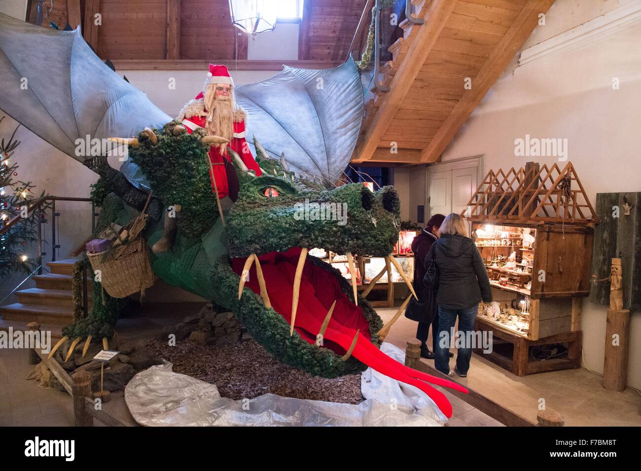 A model of Santa riding a green dragon on display as part of the ...