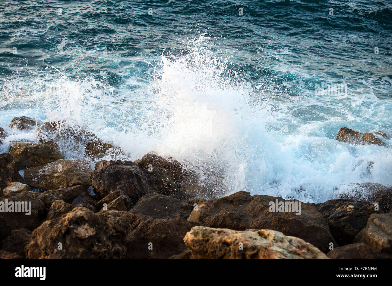Big windy waves splashing over rocks. Storm begins Stock Photo - Alamy