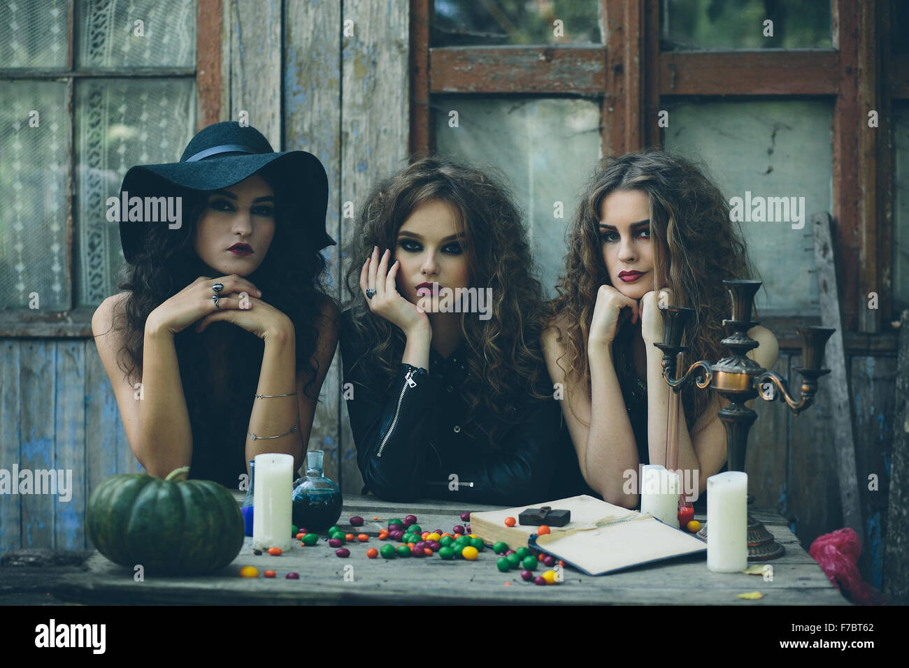 three witches at the table Stock Photo - Alamy