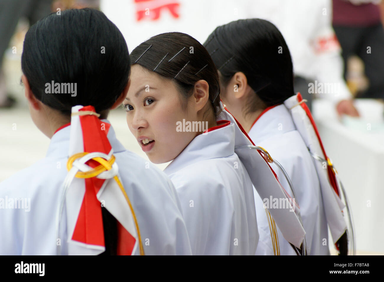 Temple girls chatting whilst at the shrine Stock Photo - Alamy