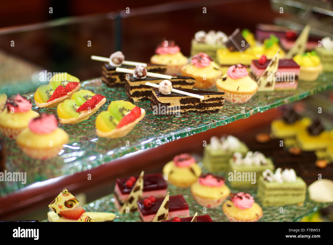 Assorted sweet desserts at buffet in a restaurant Stock Photo - Alamy