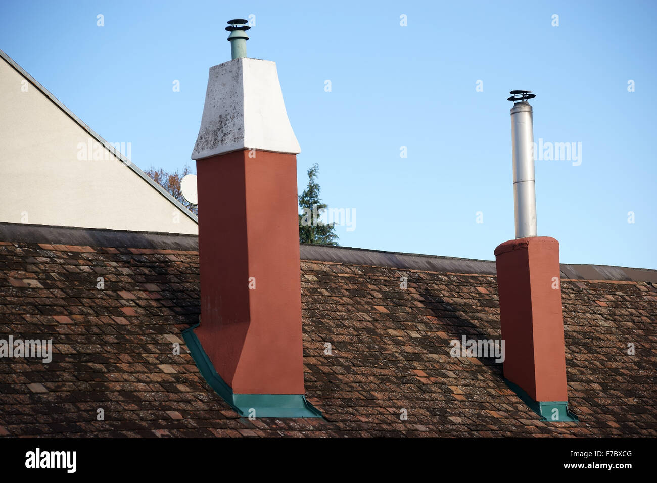 Shingle roof with two chimneys Stock Photo - Alamy