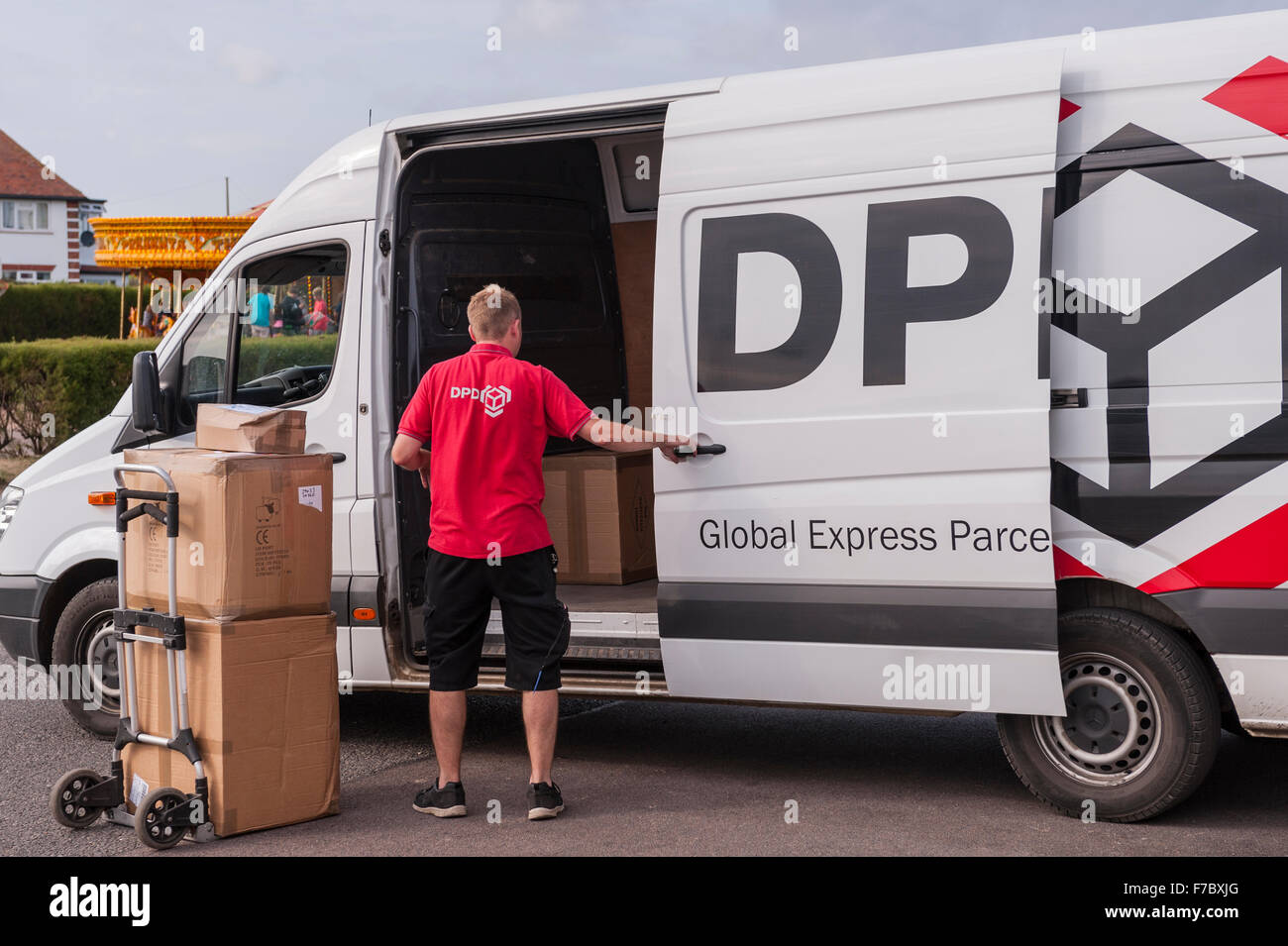 A DPD delivery driver delivering parcels in Southwold , Suffolk ...