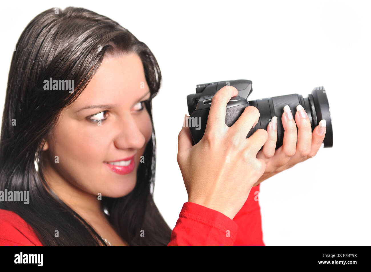 Young woman holding camera in hand taking picture isolated Stock Photo ...