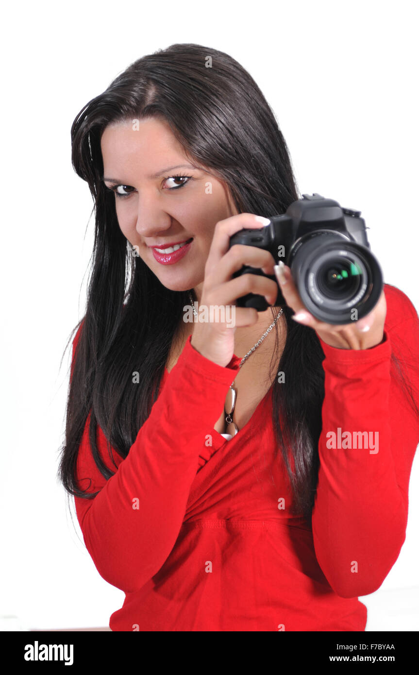 Young woman holding camera in hand taking picture isolated Stock Photo ...