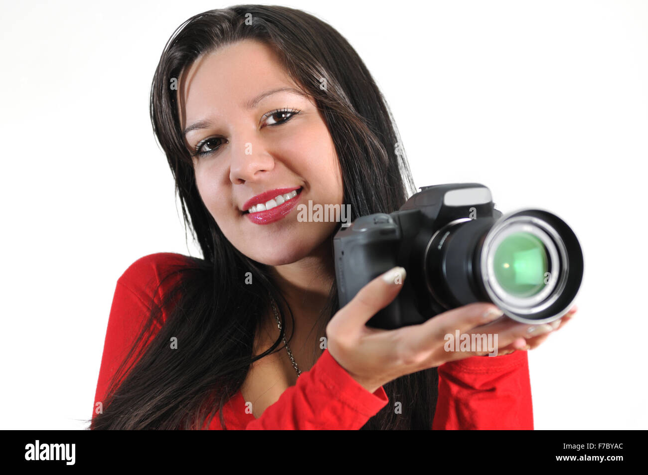 Young woman holding camera in hand taking picture isolated Stock Photo ...