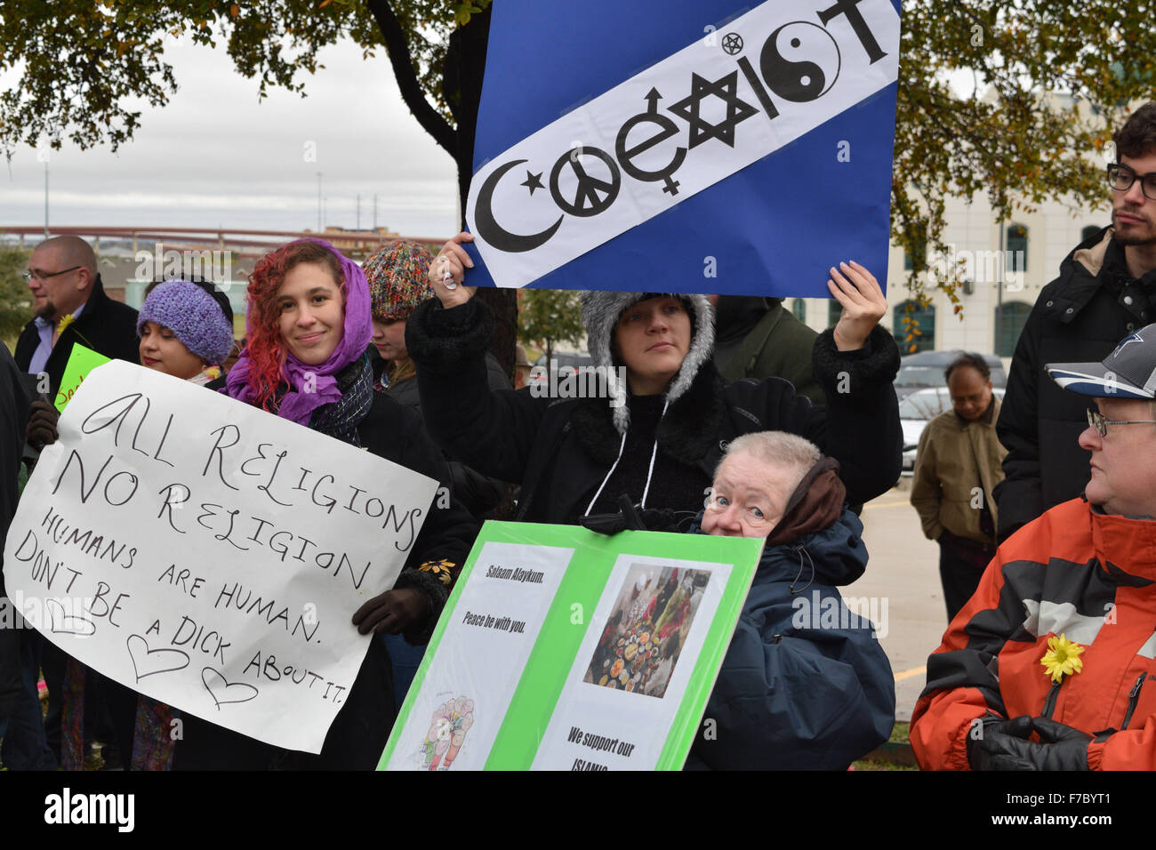 Irving, Texas, USA. 28th Nov, 2015. Protesters hold signs touting ...