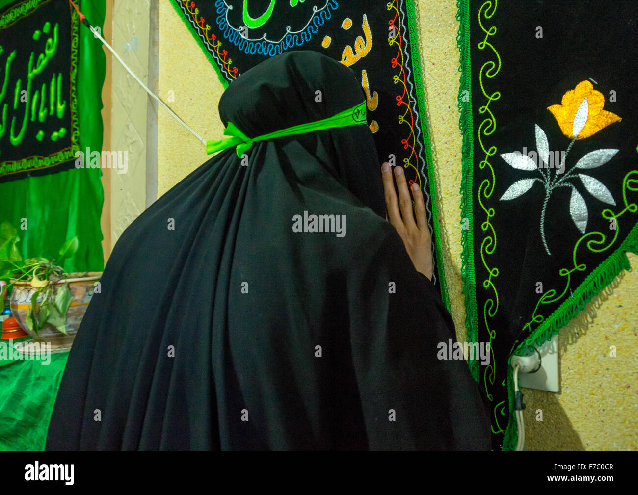 Iranian Woman Kissing A Shiite Banner For Chehel Menbari Festival On ...