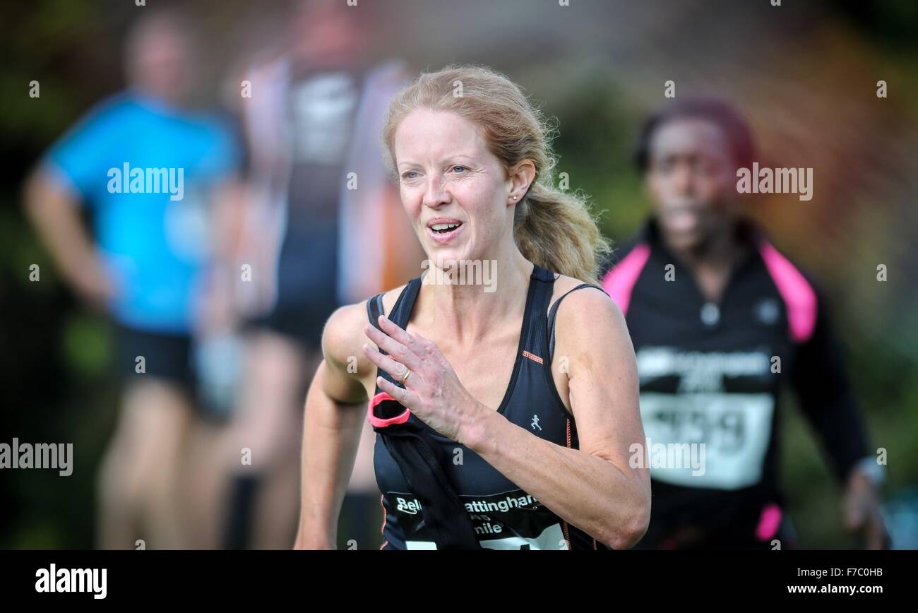 Female runner enjoying her race run at a local 7 mile cross country ...