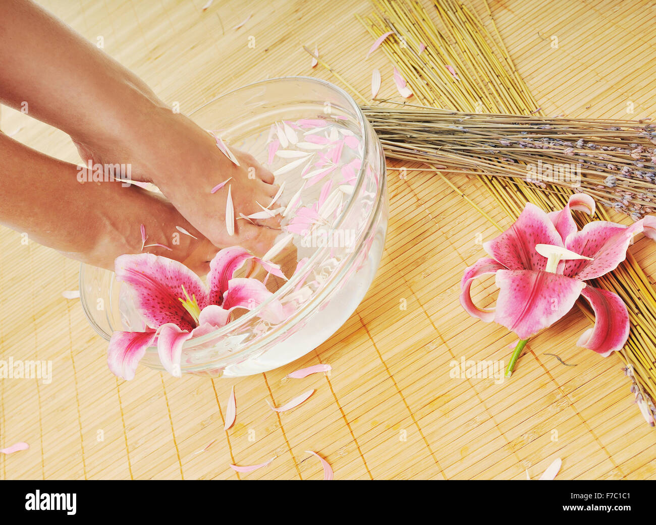 woman spa pedicure foot treatment with water and flower Stock Photo - Alamy