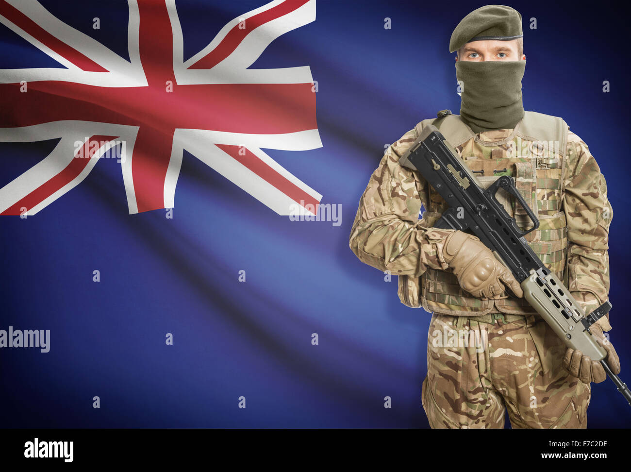 Soldier holding machine gun with national flag on background - New ...