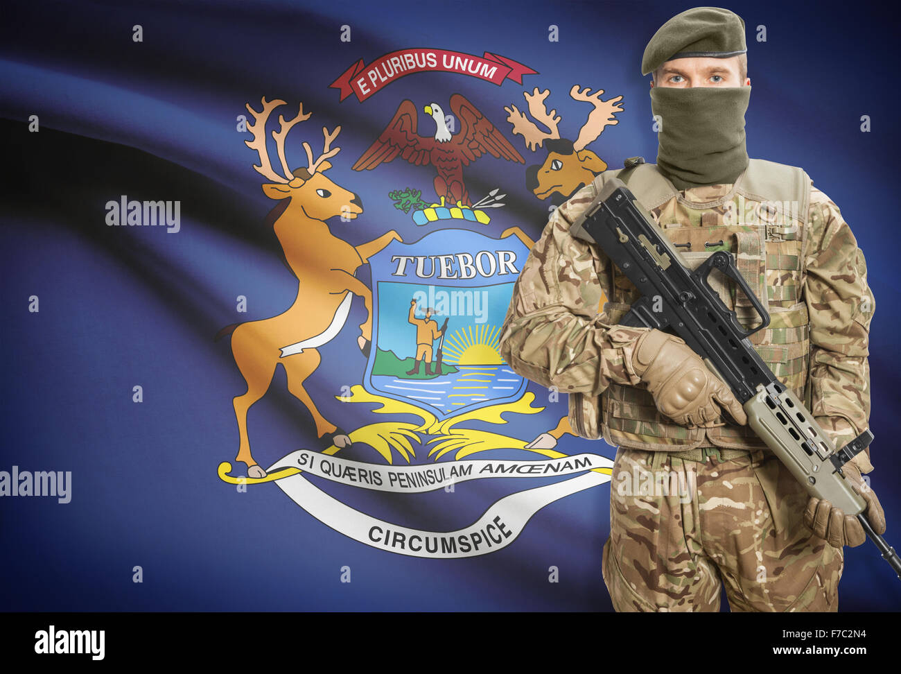 Soldier holding machine gun with USA state flag on background ...