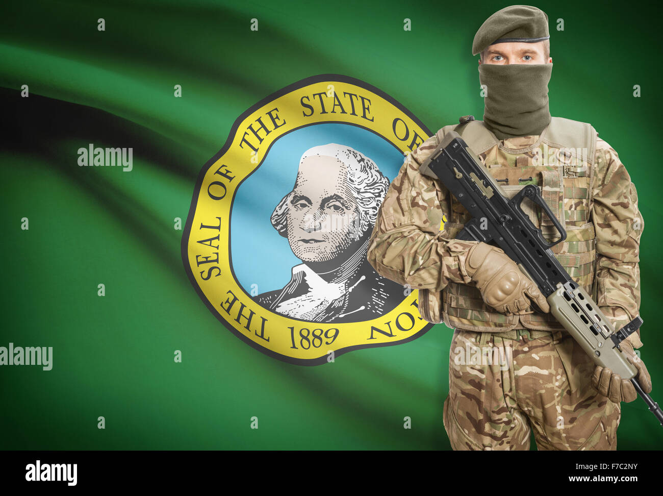 Soldier holding machine gun with USA state flag on background ...