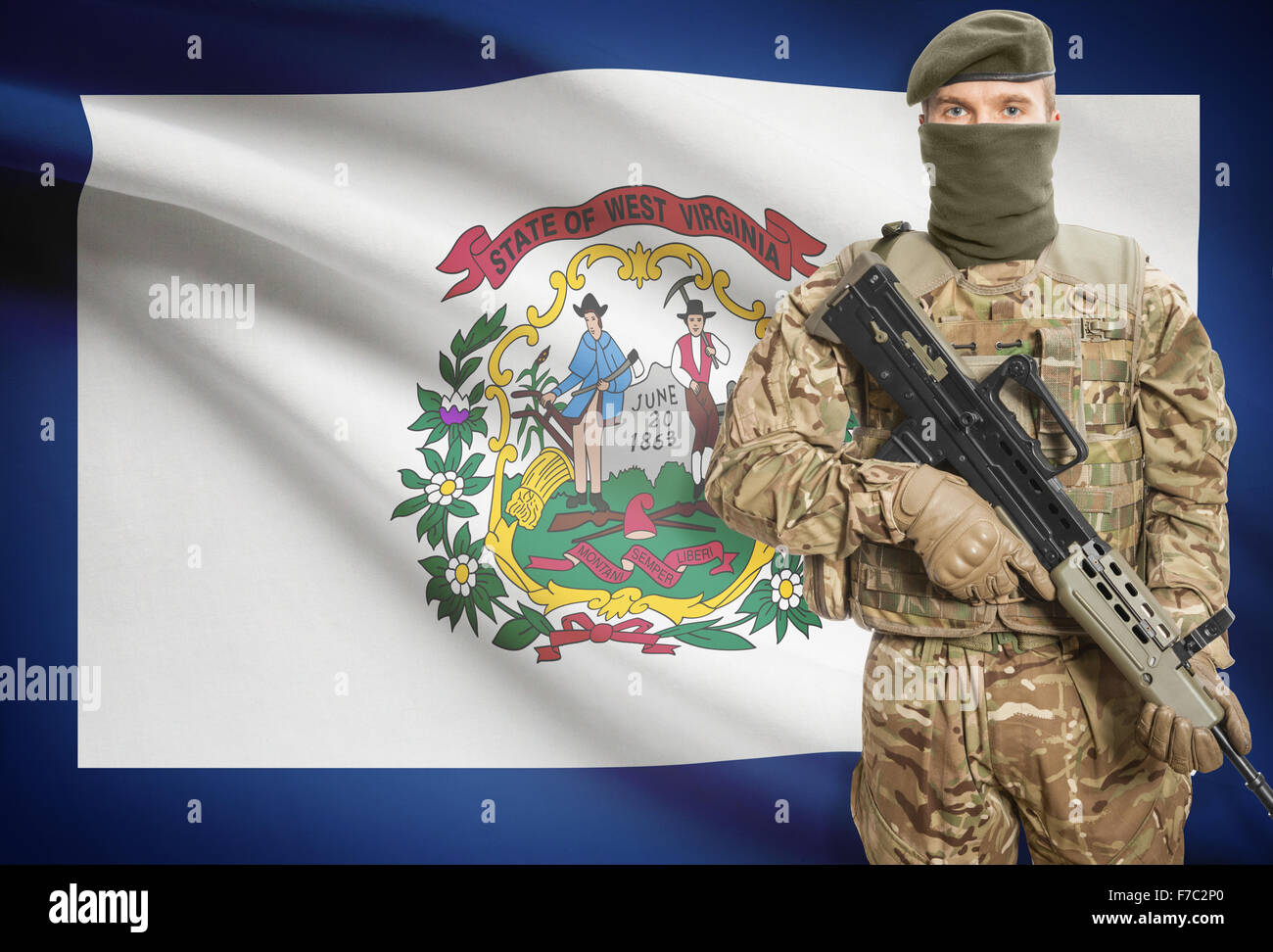 Soldier holding machine gun with USA state flag on background - West ...