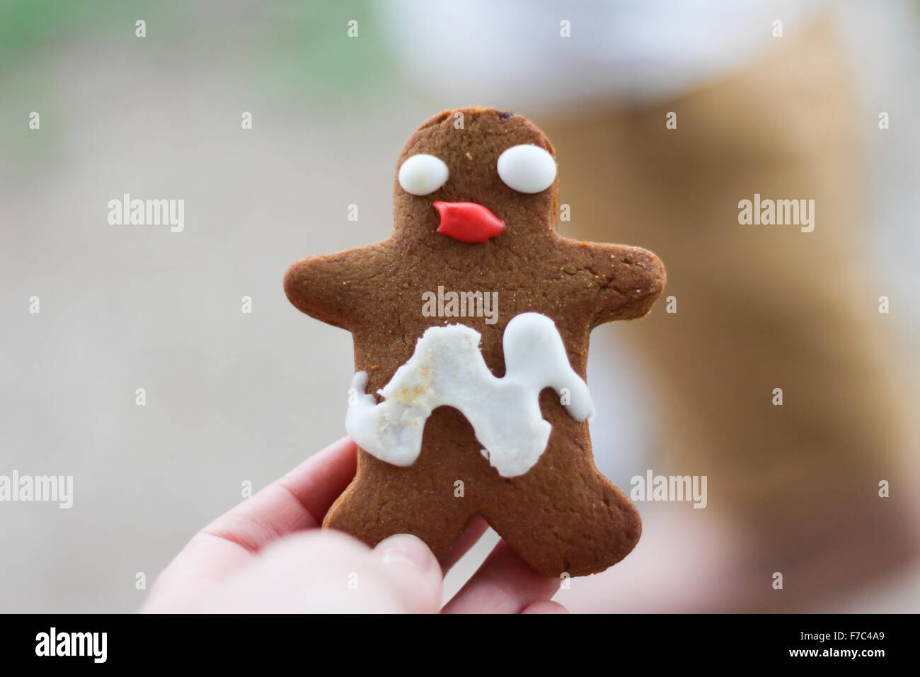 Funny looking gingerbread man with smudged icing Stock Photo - Alamy