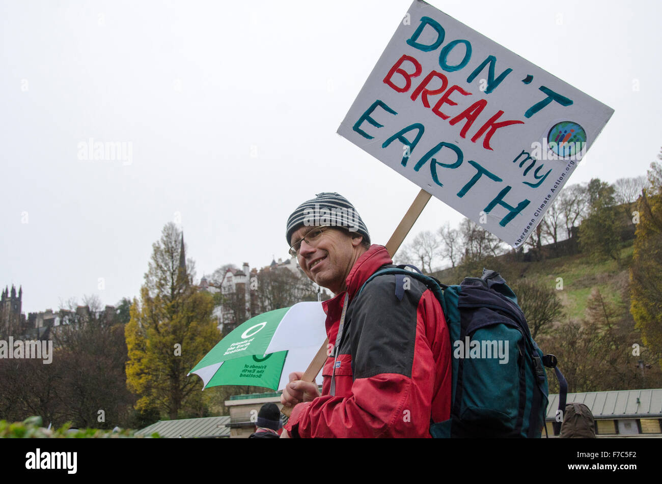 Protester holds poster ‘Don't Break My Earth’ in Scotland's climate ...