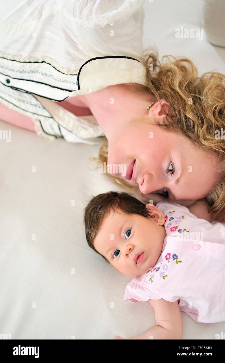 beautiful young mother small with little baby Stock Photo - Alamy