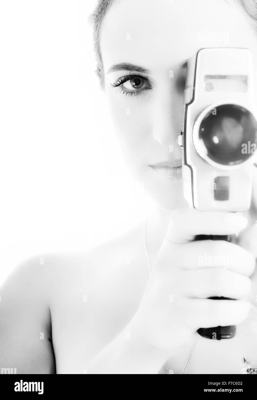 young beautiful woman face closeup with old fashion film camera Stock ...