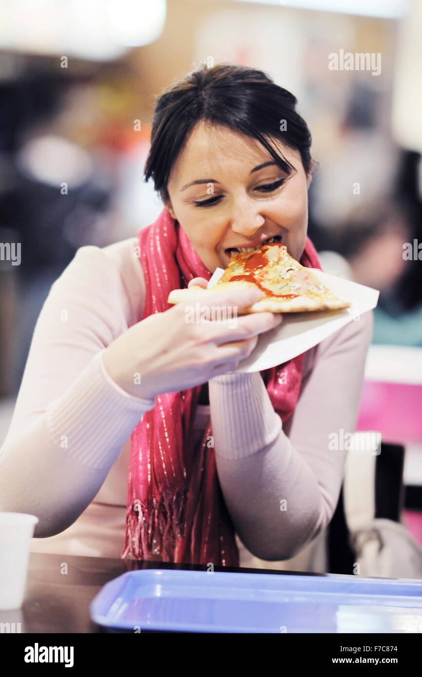 portrait of young woman eat pizza food at restaurant Stock Photo - Alamy