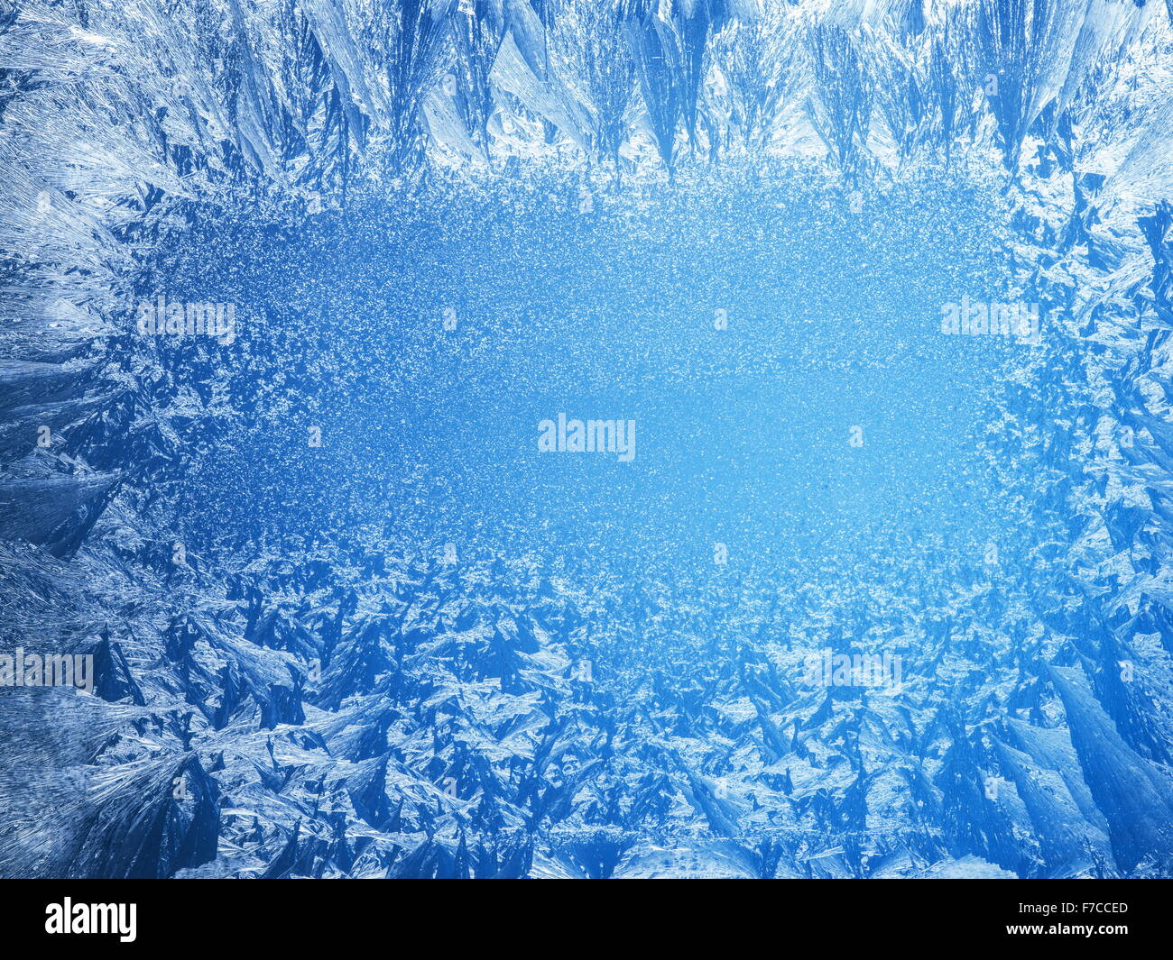 Frosty patterns on the edge of a frozen window Stock Photo - Alamy