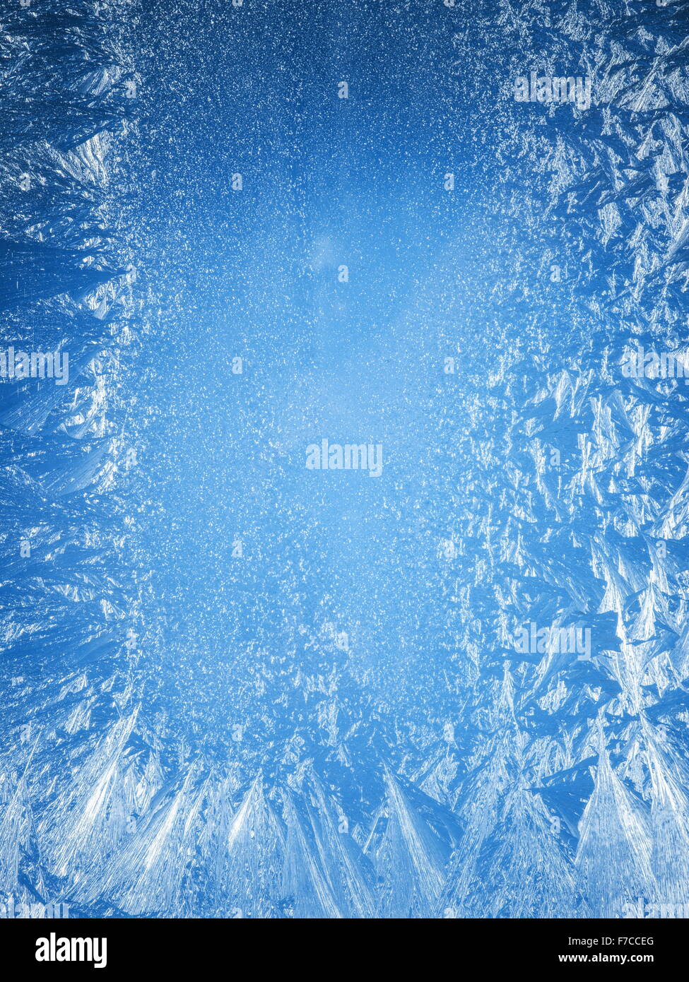 Frosty patterns on the edge of a frozen window Stock Photo - Alamy