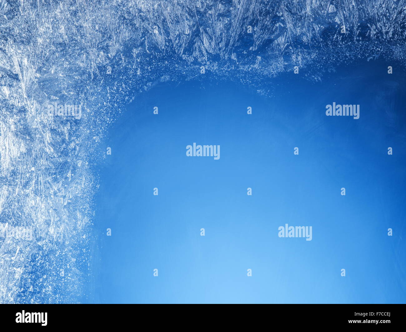 Frosty patterns on the edge of a frozen window Stock Photo - Alamy