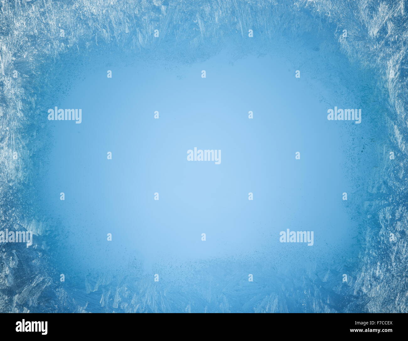 Frosty patterns on the edge of a frozen window Stock Photo - Alamy