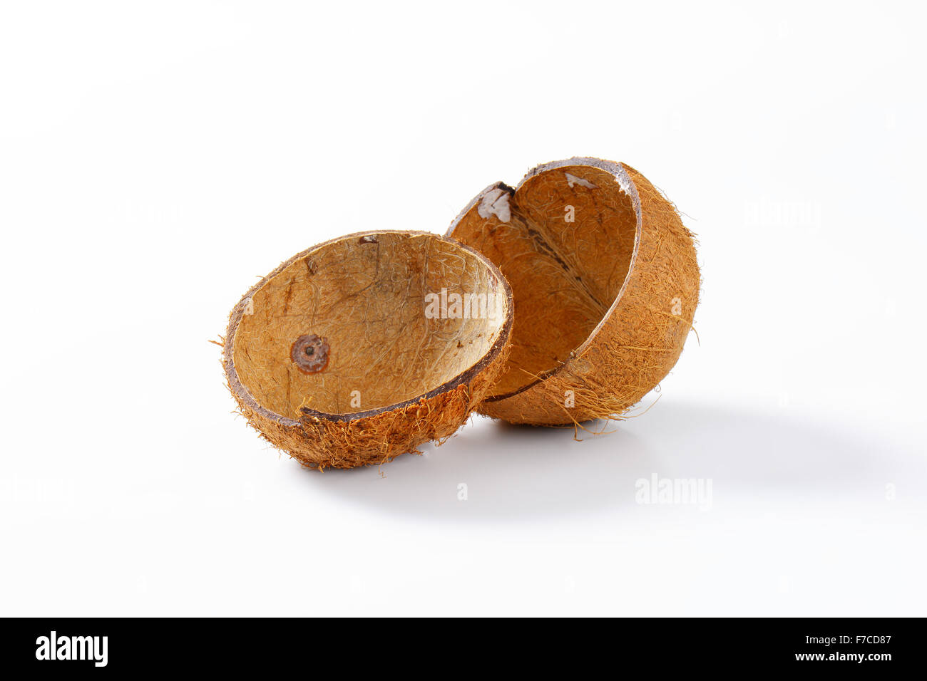 Two halves of a coconut shell Stock Photo - Alamy