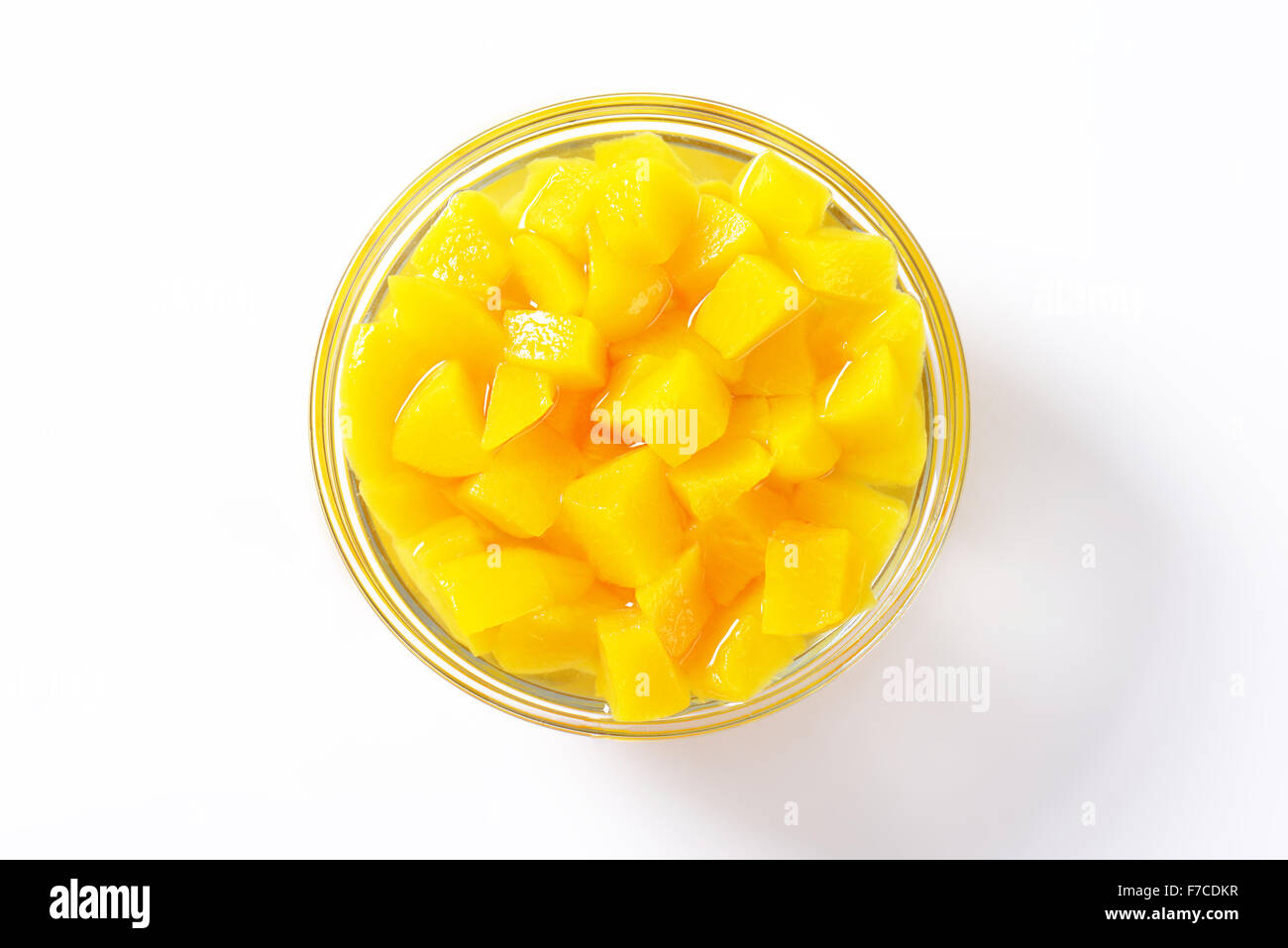 Bowl of diced peach in light syrup Stock Photo - Alamy