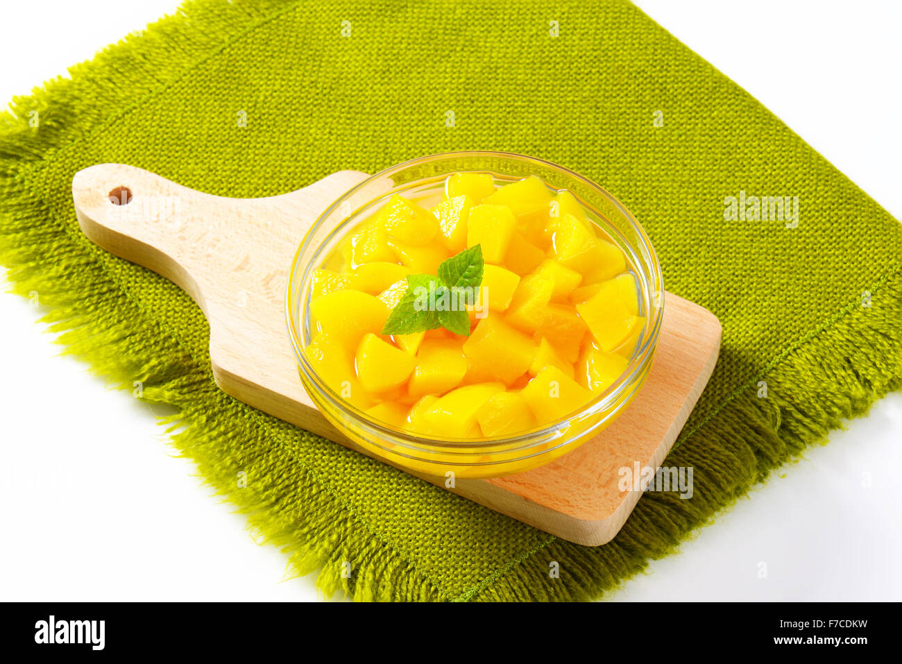 Bowl of diced peach in light syrup Stock Photo - Alamy