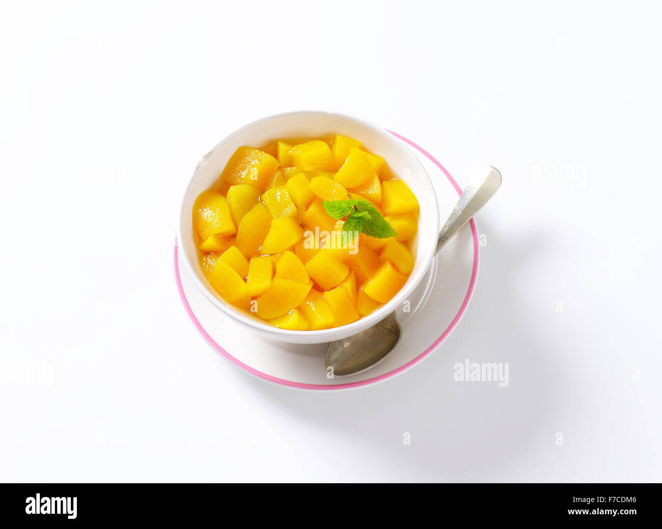 Bowl of diced peach in light syrup Stock Photo - Alamy