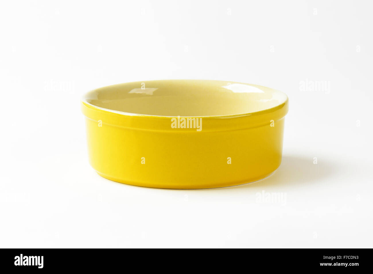 Small empty yellow souffle dish Stock Photo - Alamy