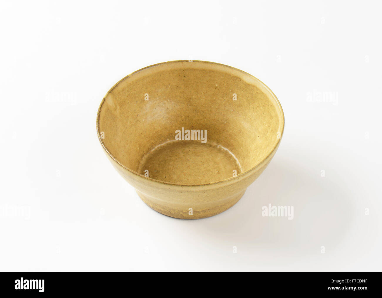 Empty beige bowl on white background Stock Photo - Alamy
